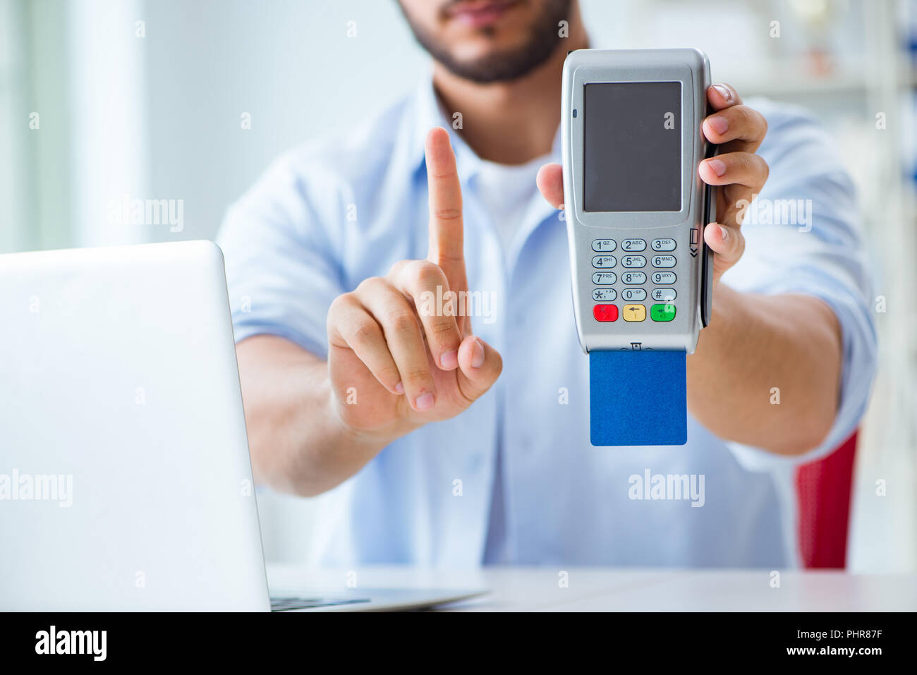 Man processing credit card transaction with POS terminal Stock Photo ...