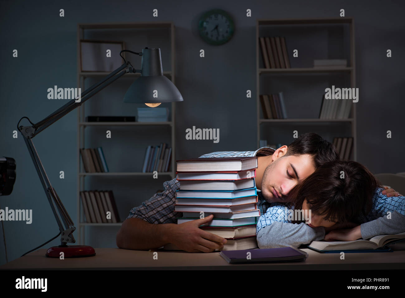 Two students studying late at night Stock Photo - Alamy