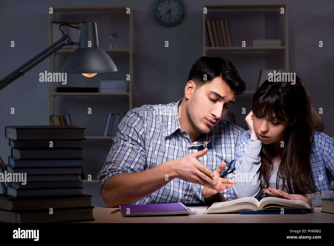 Two students studying late at night Stock Photo - Alamy