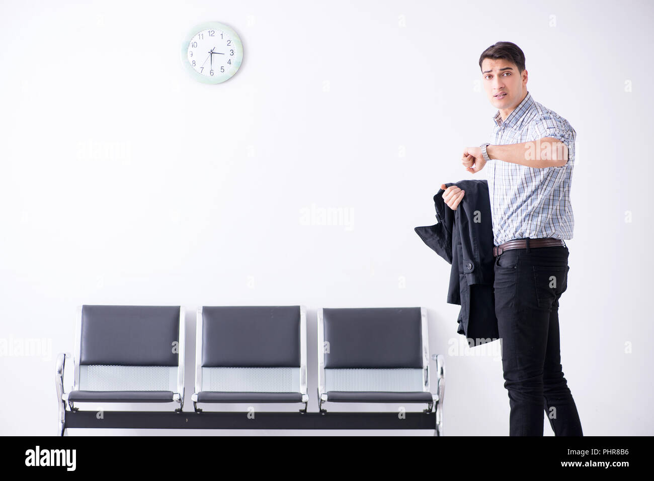 Man nervously impatiently waiting in the lobby Stock Photo - Alamy