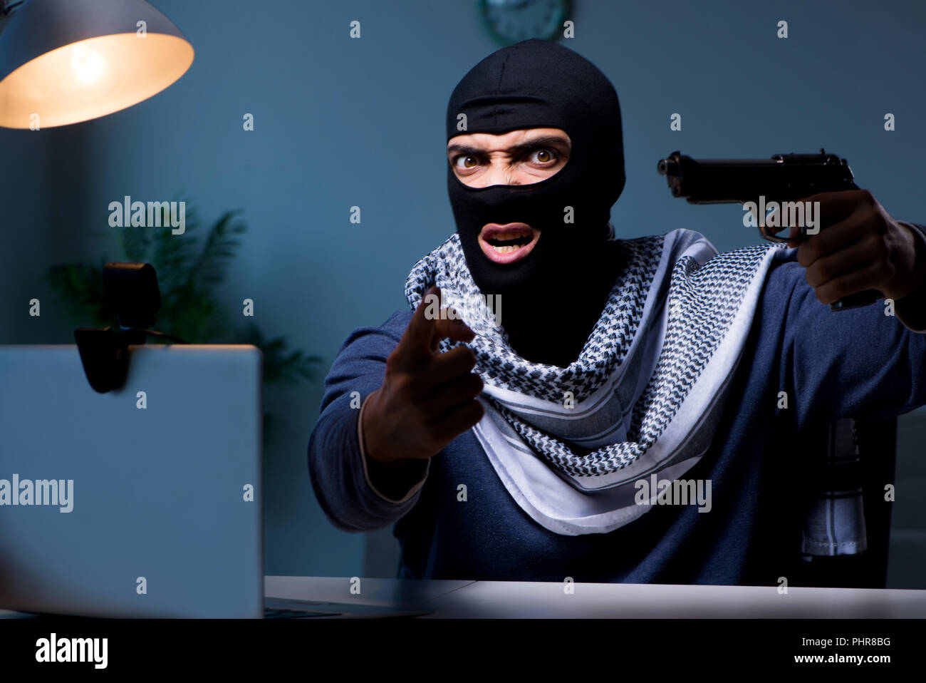 Pointing gun at computer hi-res stock photography and images - Alamy