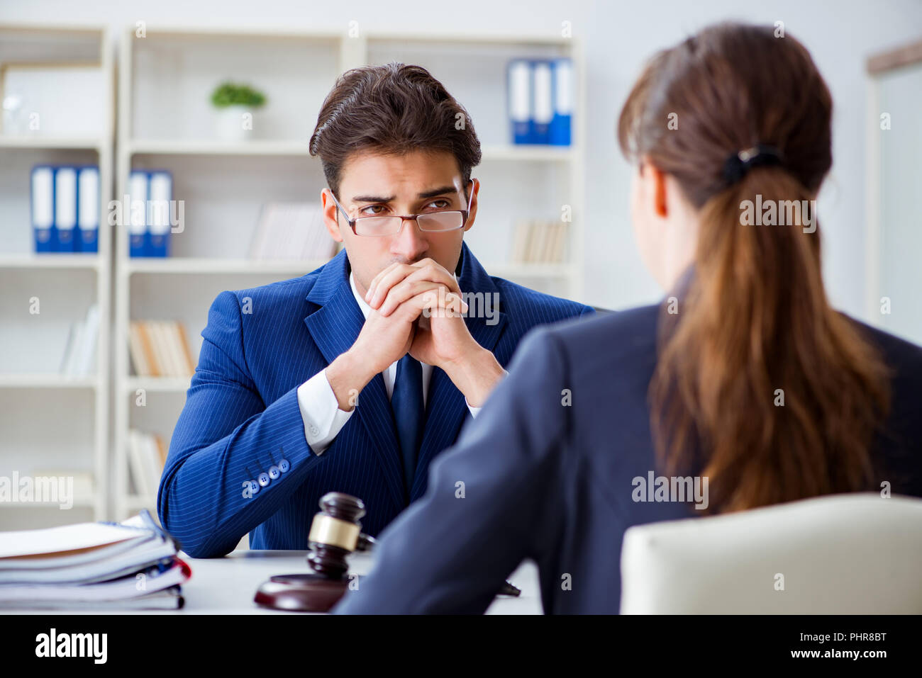 Lawyer talking to his client in office Stock Photo - Alamy