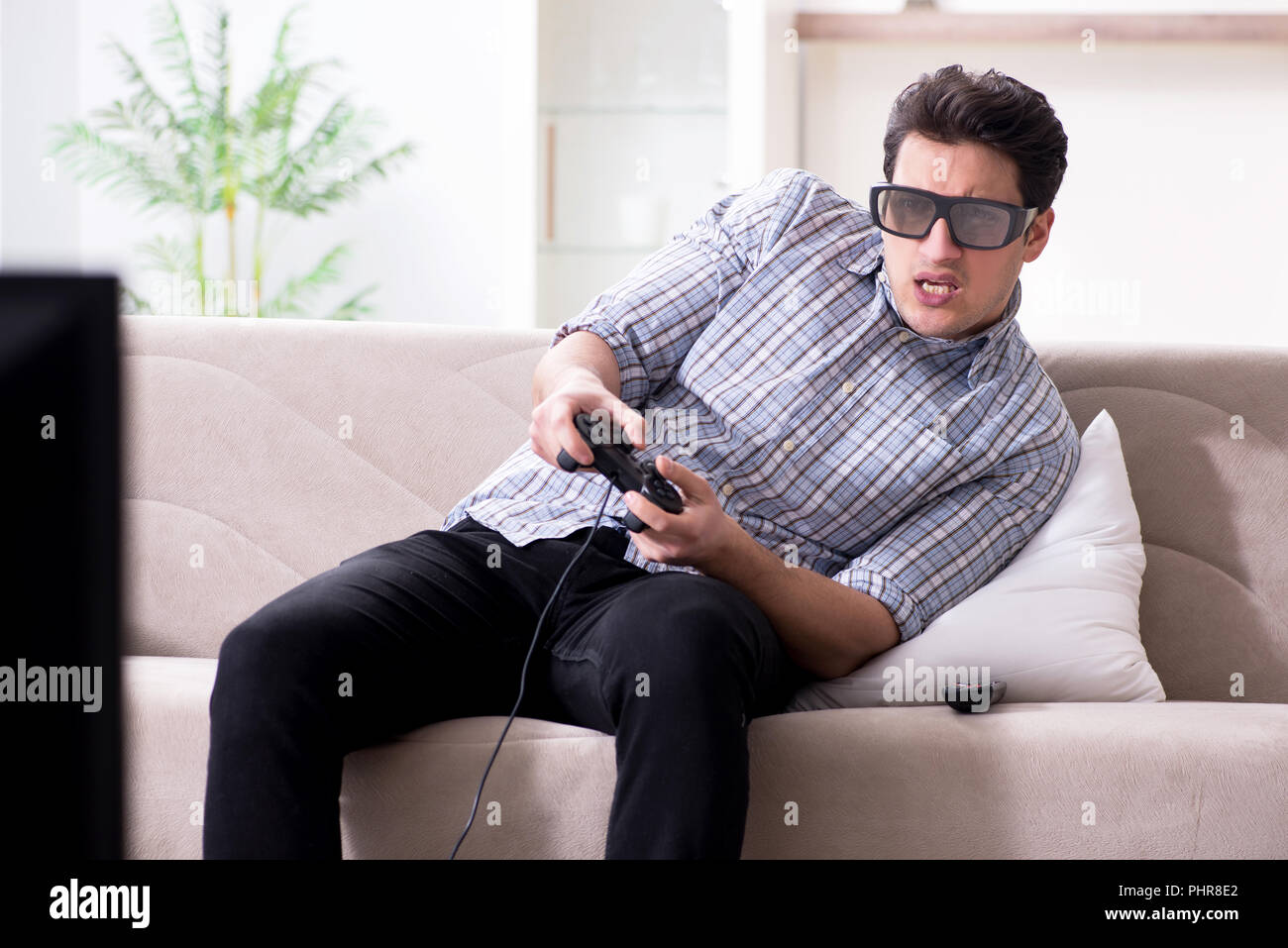 Man playing 3d games at home Stock Photo - Alamy