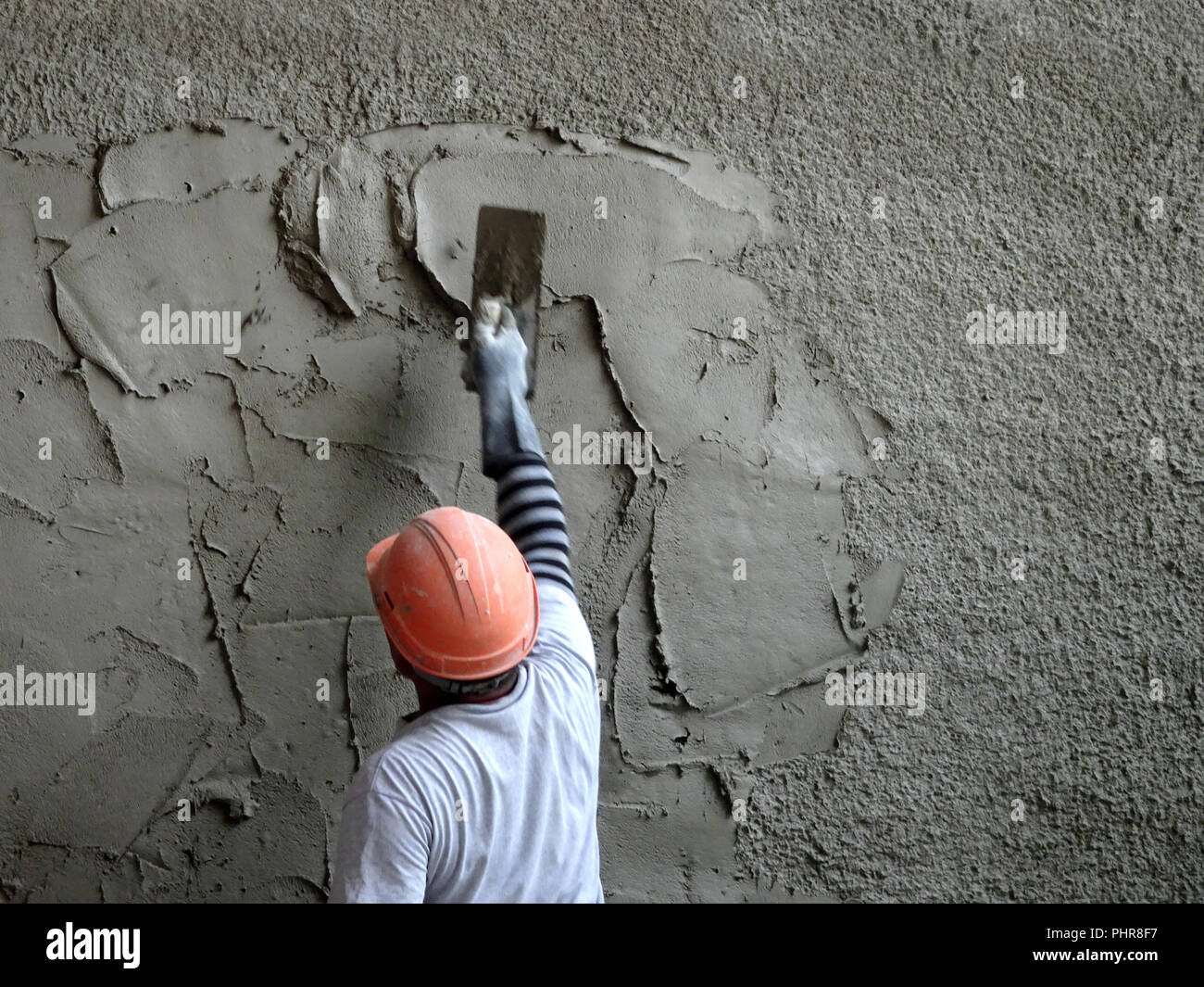 Construction Workers Plastering Wall Using Cement Plaster At The Construction Site They Are