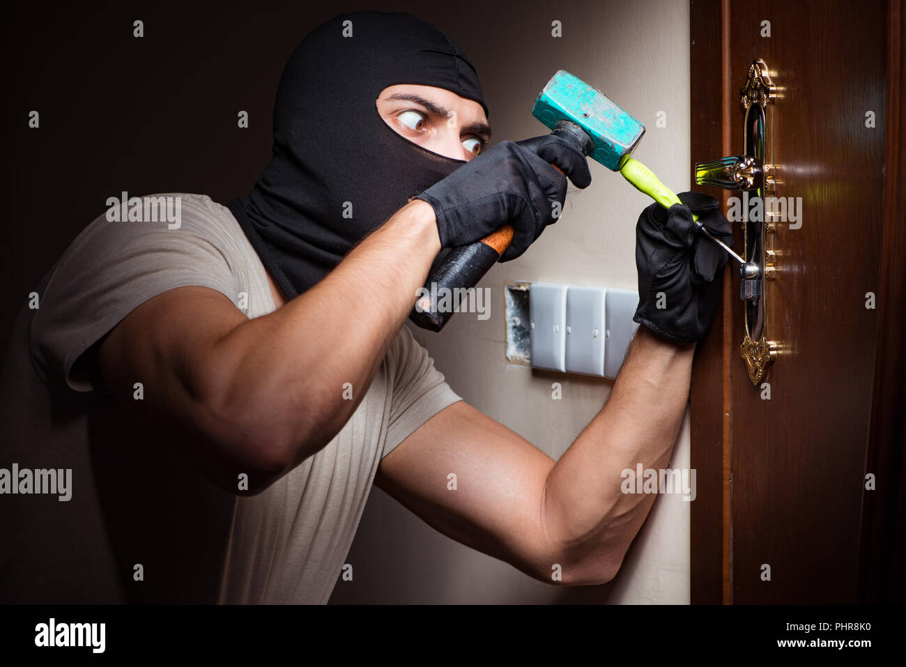 Burglar wearing balaclava mask at crime scene Stock Photo - Alamy