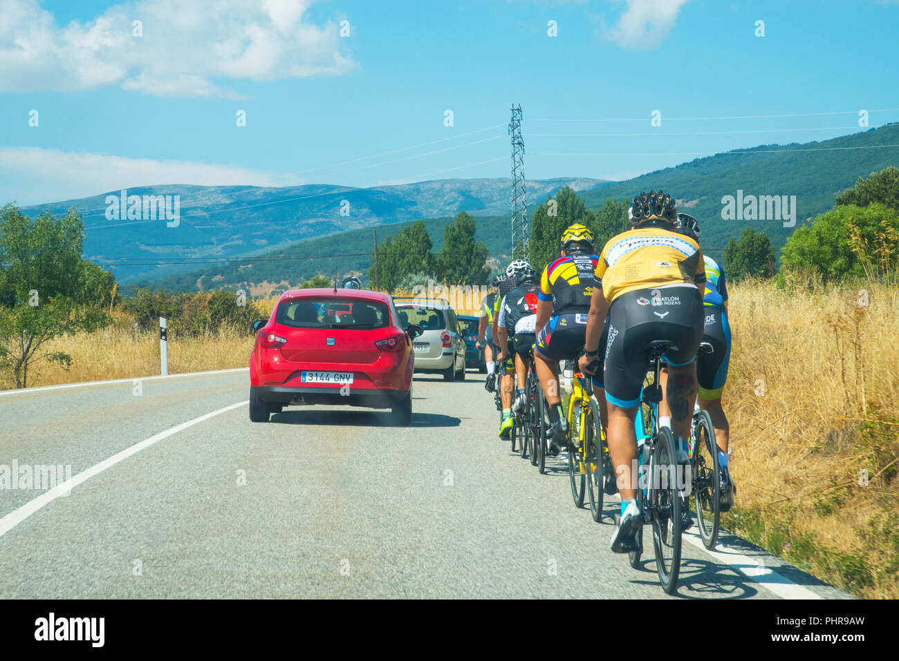 Car overtaking a bike hi-res stock photography and images - Alamy