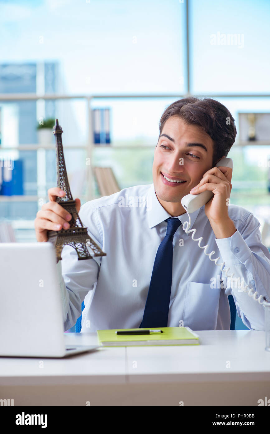 Sales agent working in travel agency Stock Photo - Alamy