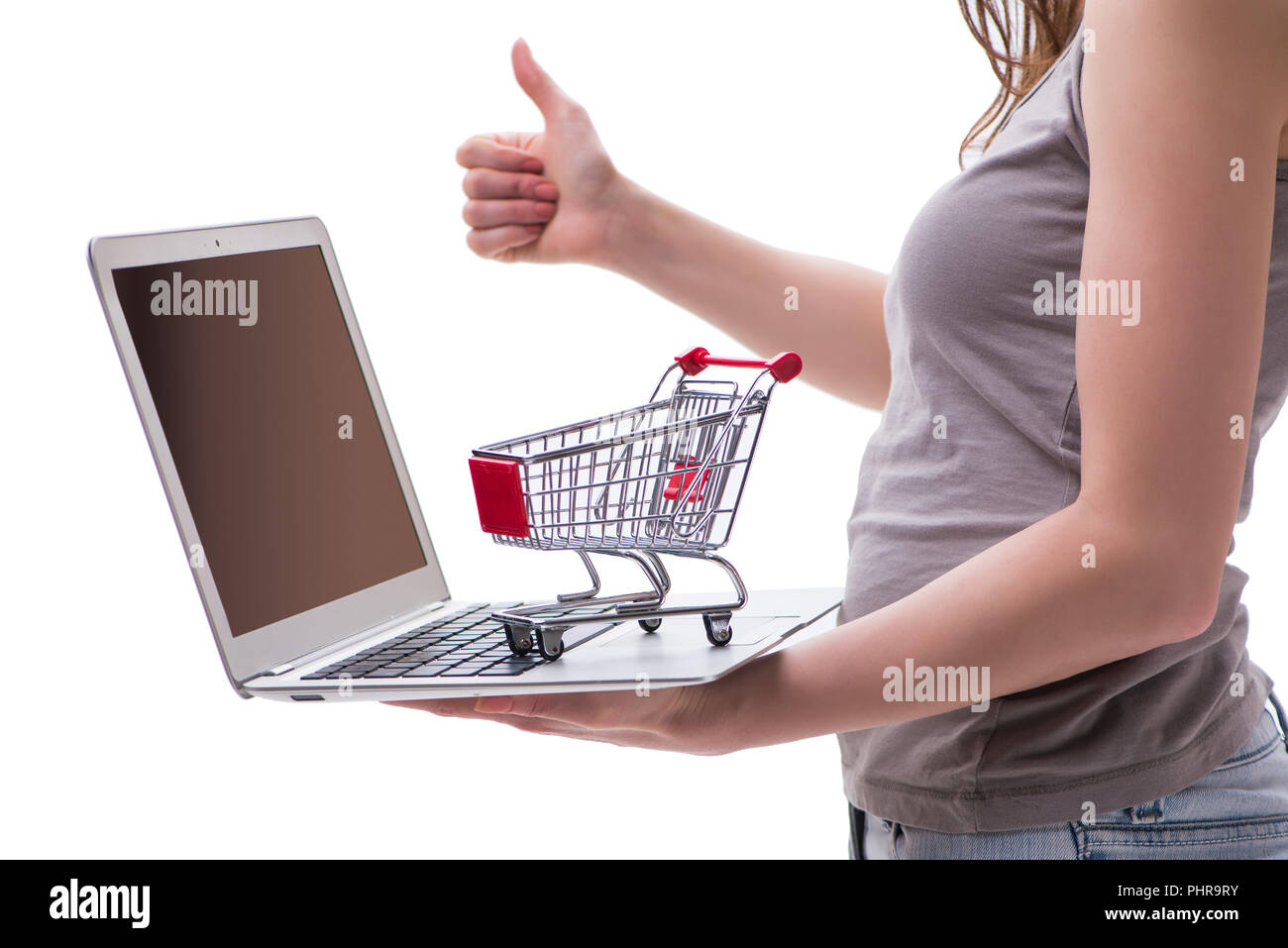 Online shopping concept with laptop and trolley Stock Photo - Alamy
