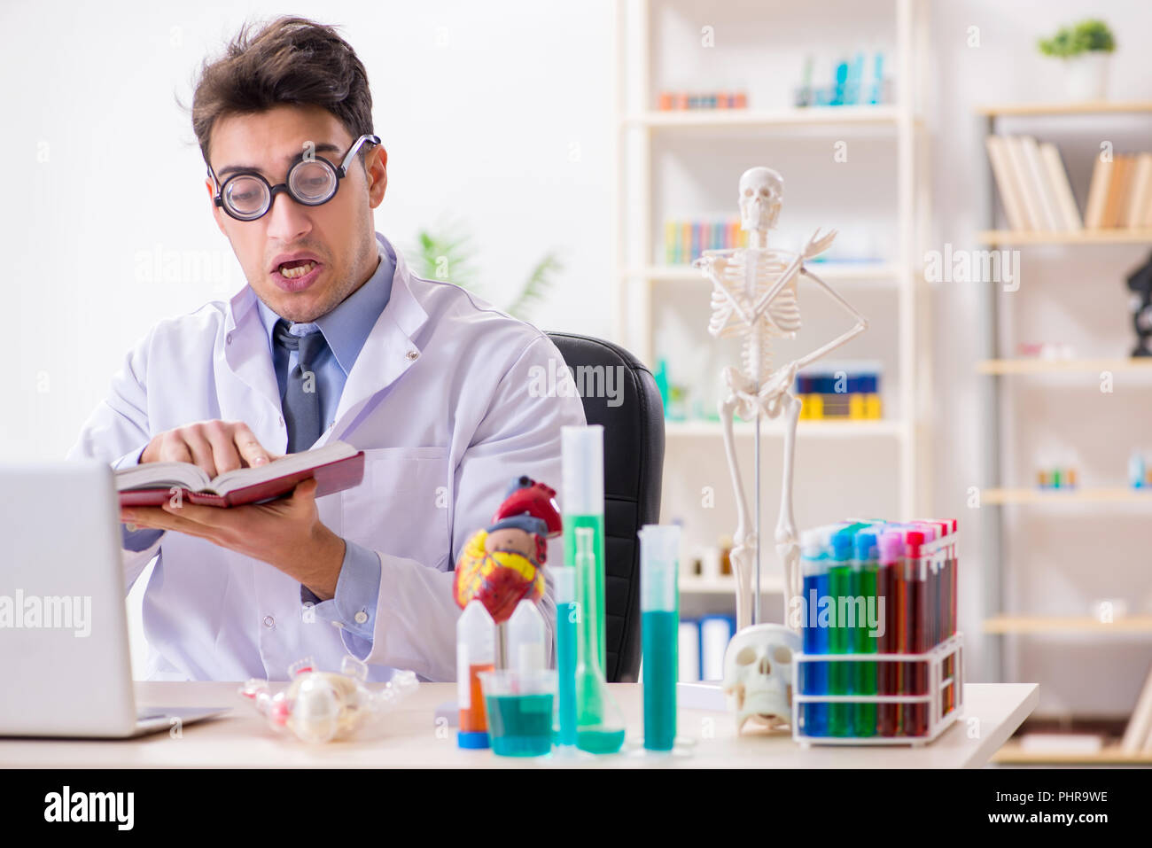 Funny doctor having fun in hospital lab Stock Photo - Alamy