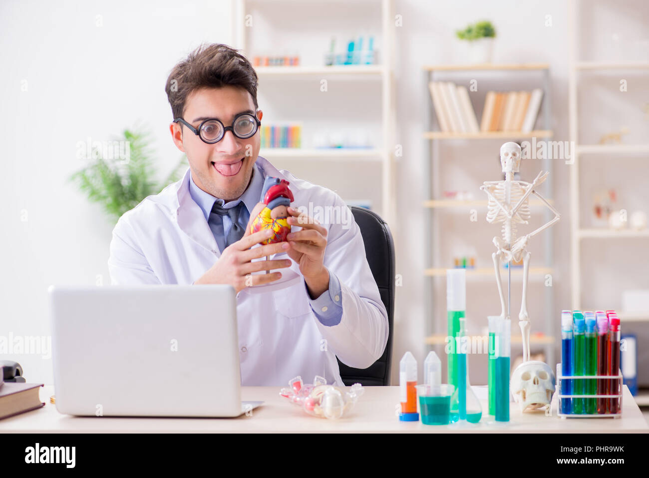 Funny doctor having fun in hospital lab Stock Photo - Alamy