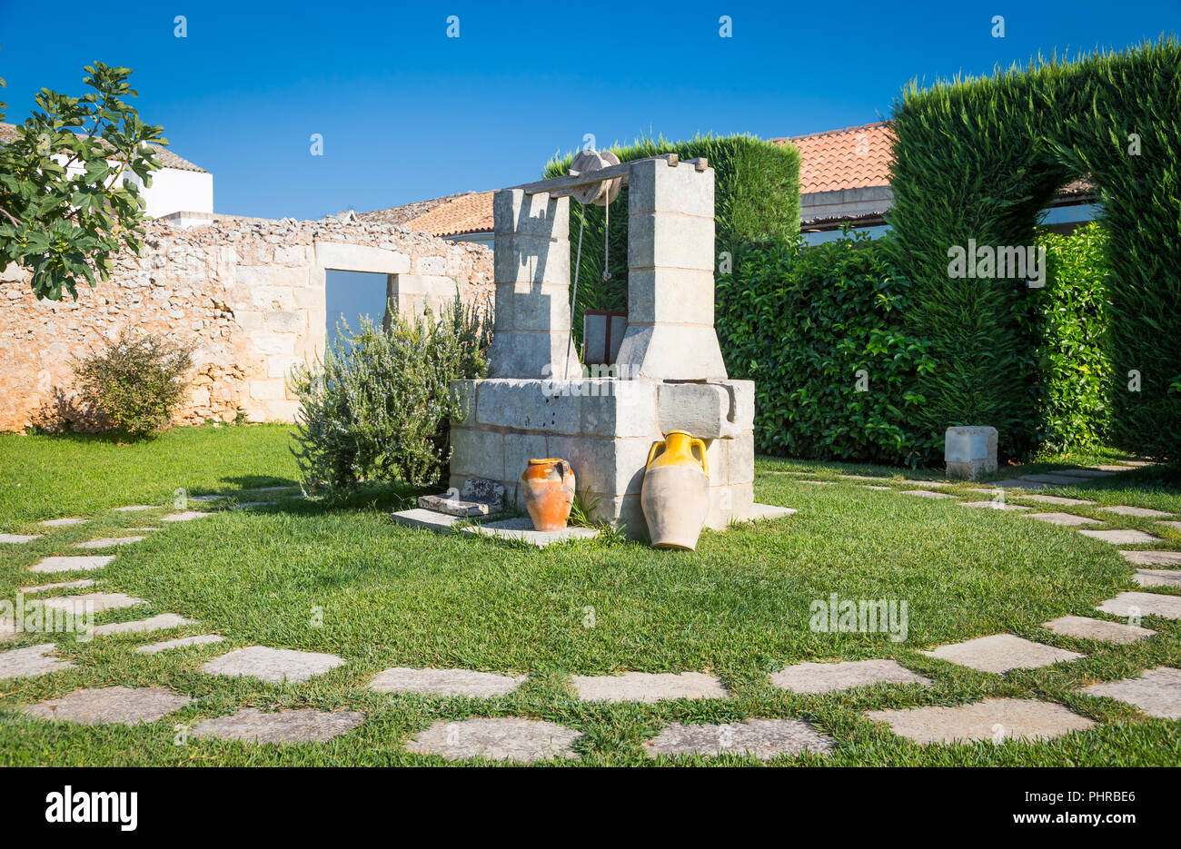 Vintage water well Stock Photo - Alamy