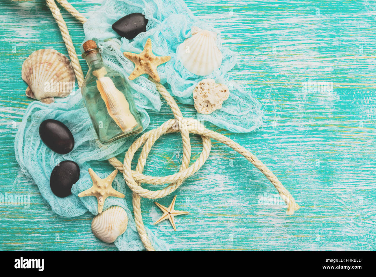 Seashells on turquoise background Stock Photo - Alamy