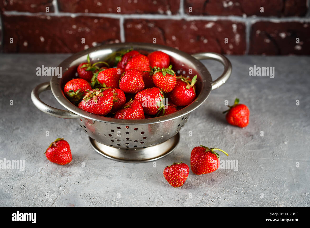 Ripe strawberry in colander Stock Photo - Alamy