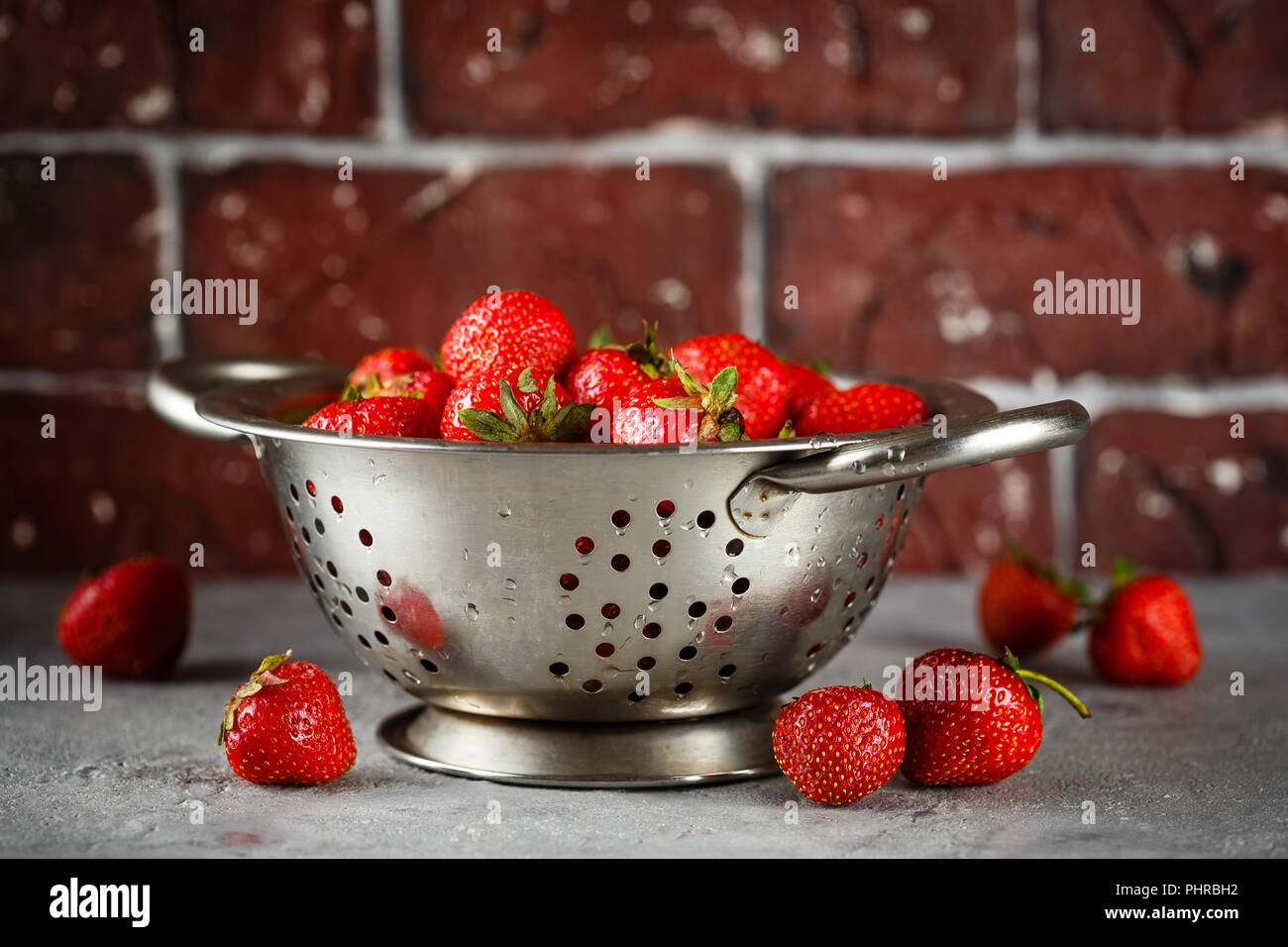Ripe strawberry in colander Stock Photo - Alamy