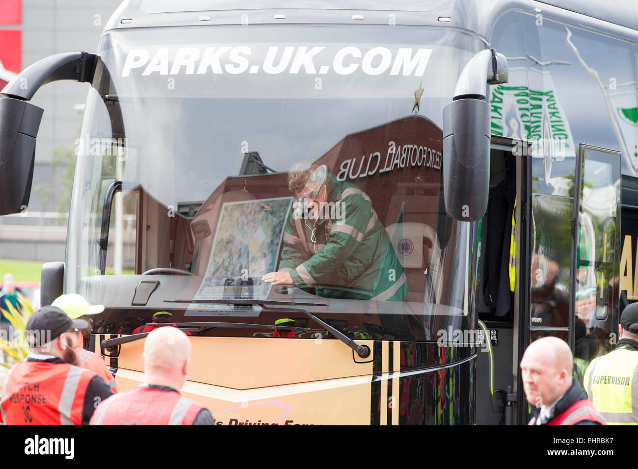 Celtic security climb onto the Rangers team bus to turn off their music ...