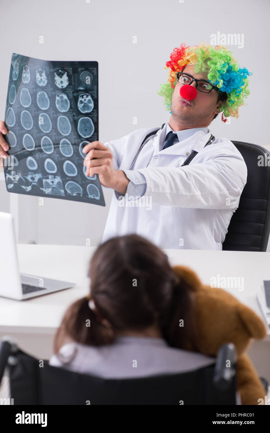 Funny pediatrician with little girl at regular check-up Stock Photo - Alamy