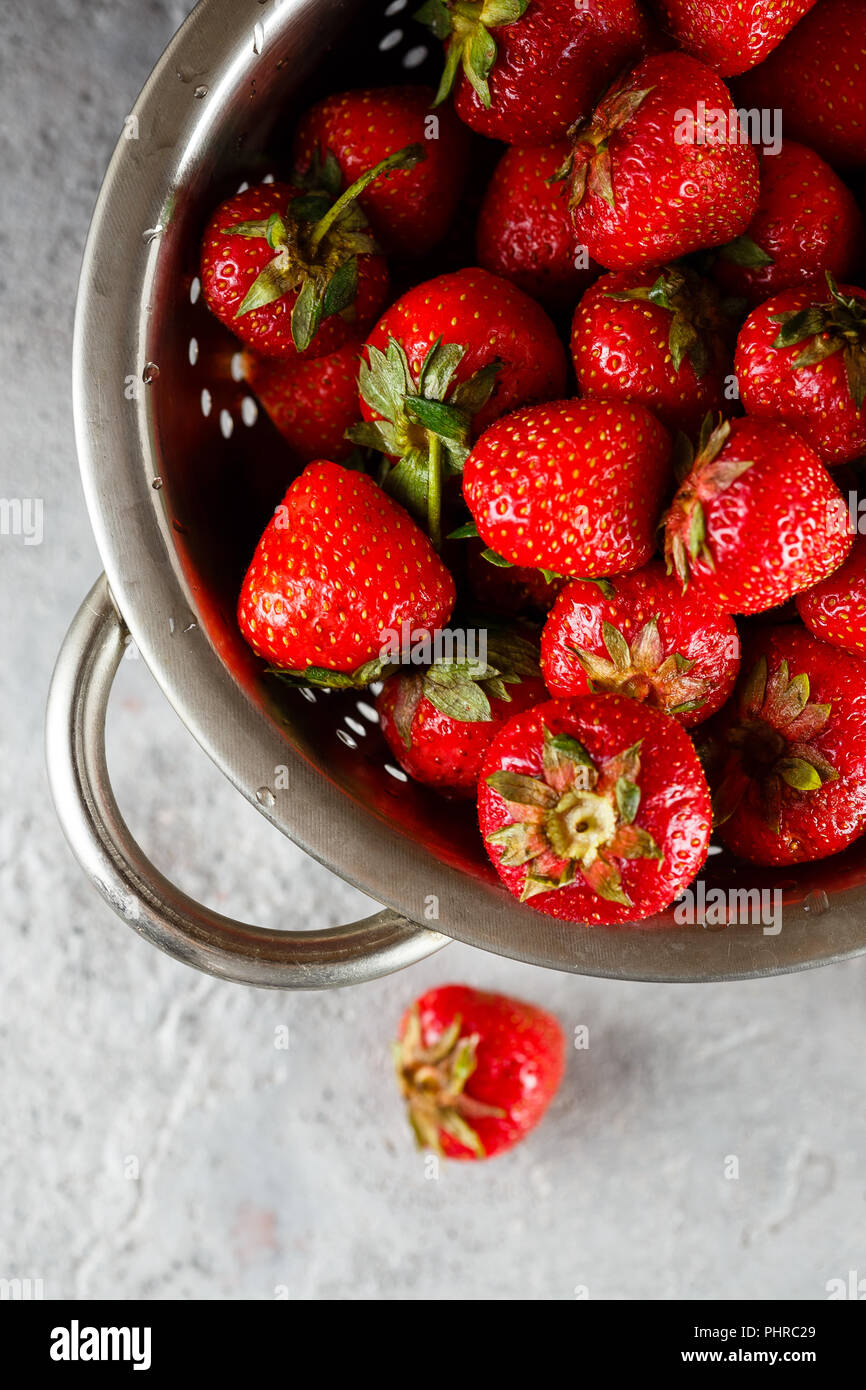 Ripe strawberry in colander Stock Photo - Alamy