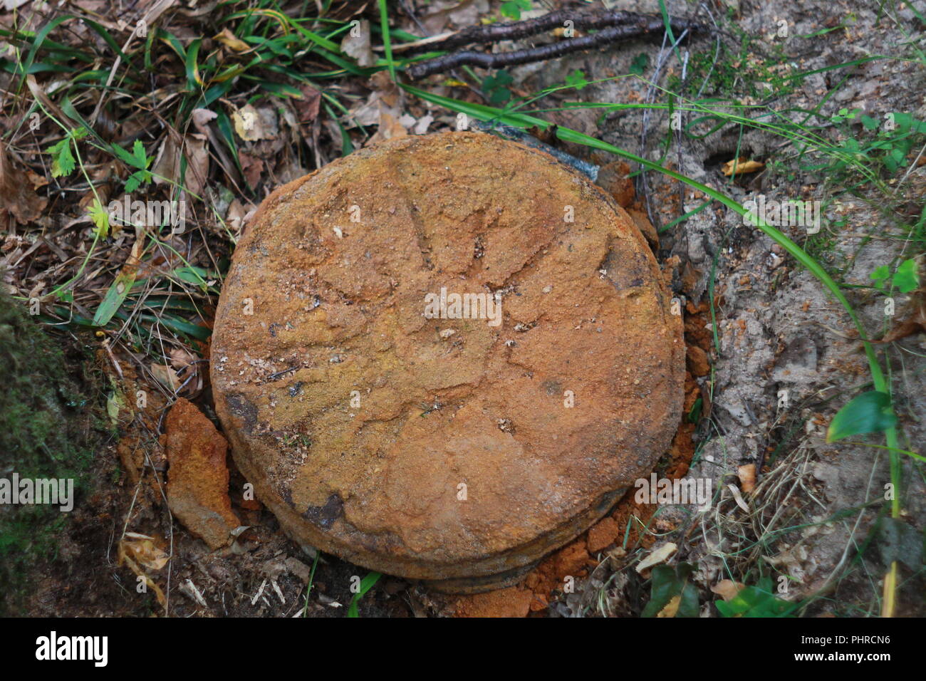 Rusty anti-tank landmine on the ground Stock Photo - Alamy