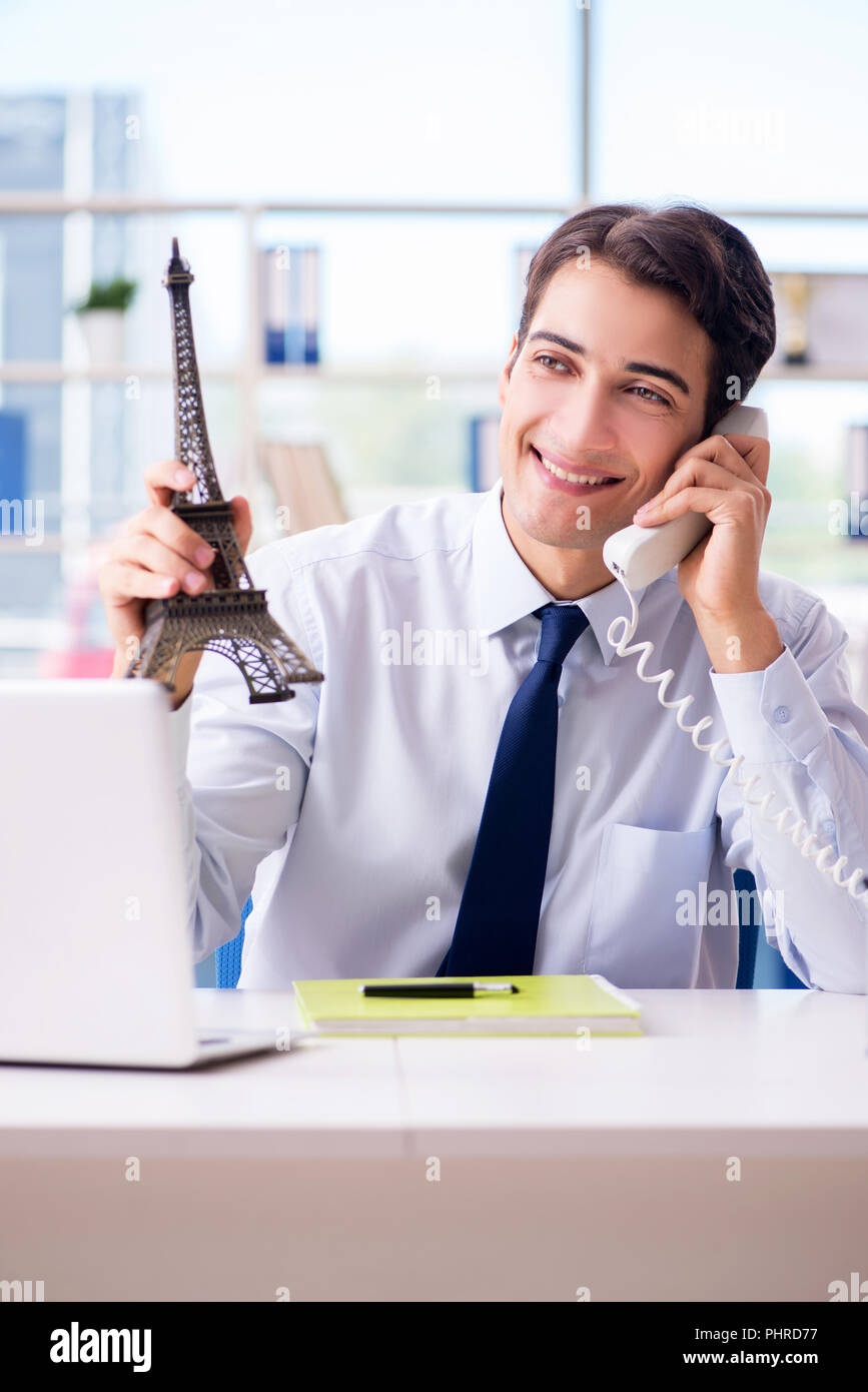 Sales agent working in travel agency Stock Photo - Alamy