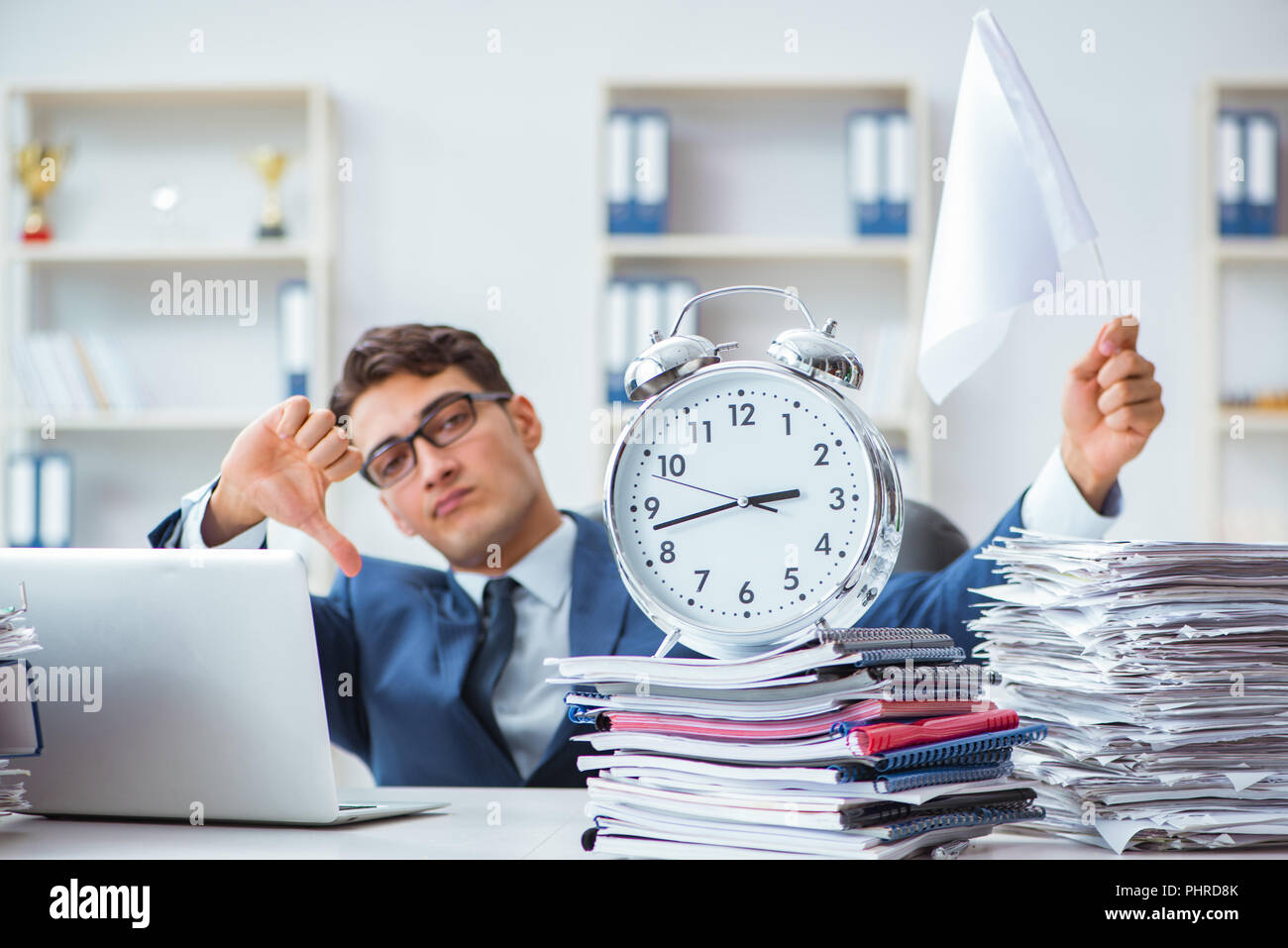 Businessman throwing white flag and giving up Stock Photo - Alamy