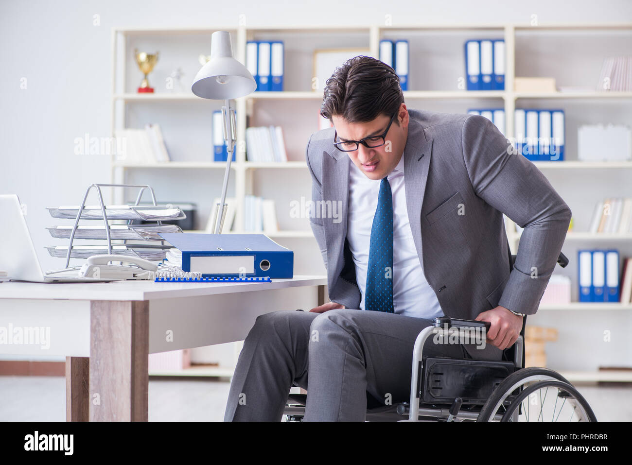 Disabled businessman working in the office Stock Photo - Alamy