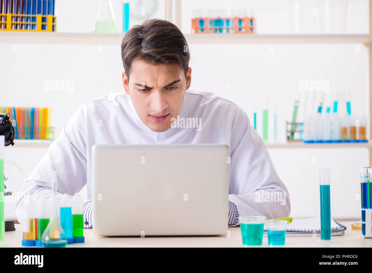 Man student working in chemical lab on experiment Stock Photo - Alamy