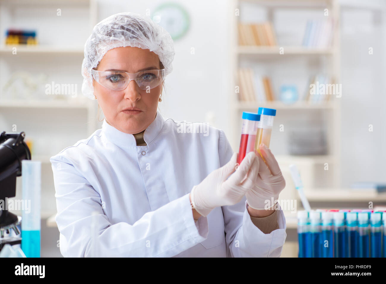 Female chemist working in lab Stock Photo - Alamy