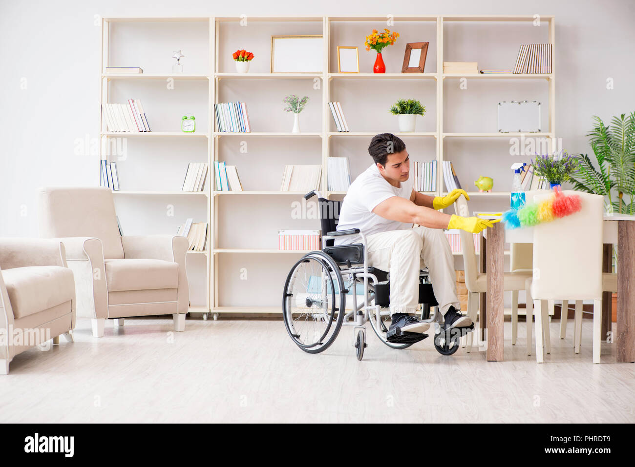 Disabled cleaner doing chores at home Stock Photo - Alamy