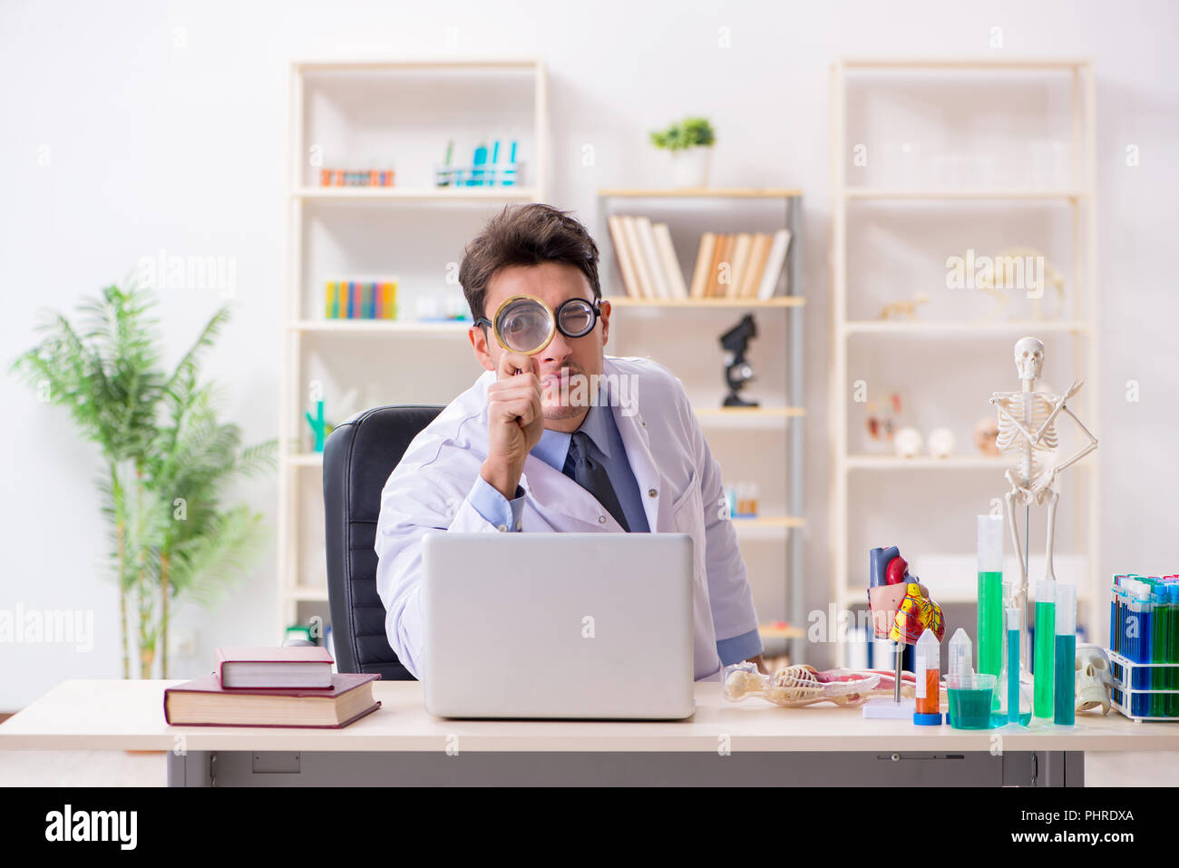 Funny doctor having fun in hospital lab Stock Photo - Alamy