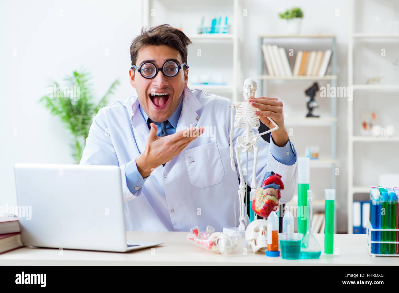 Funny doctor having fun in hospital lab Stock Photo - Alamy