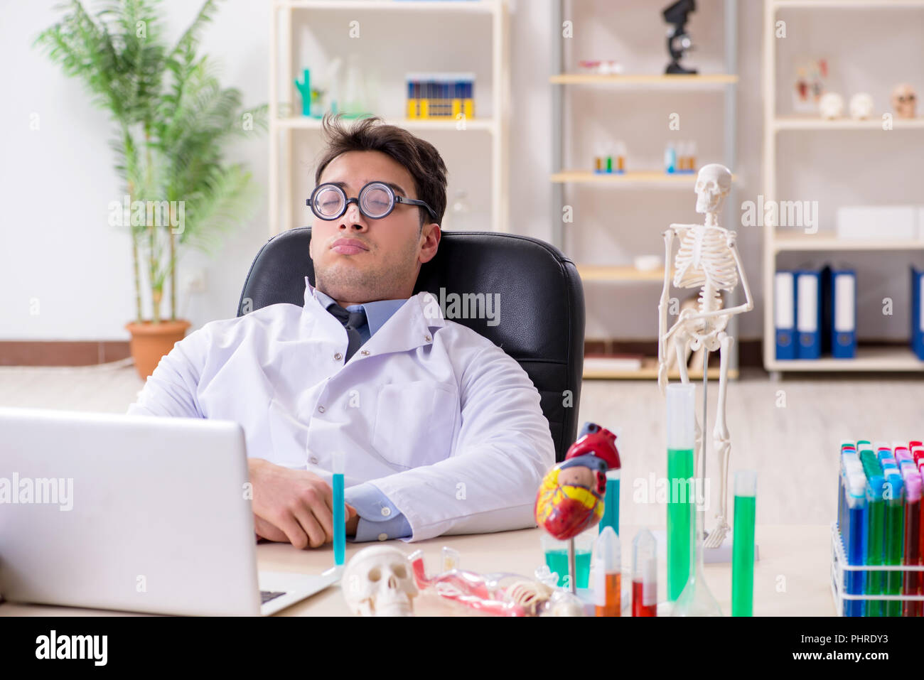 Funny doctor having fun in hospital lab Stock Photo - Alamy