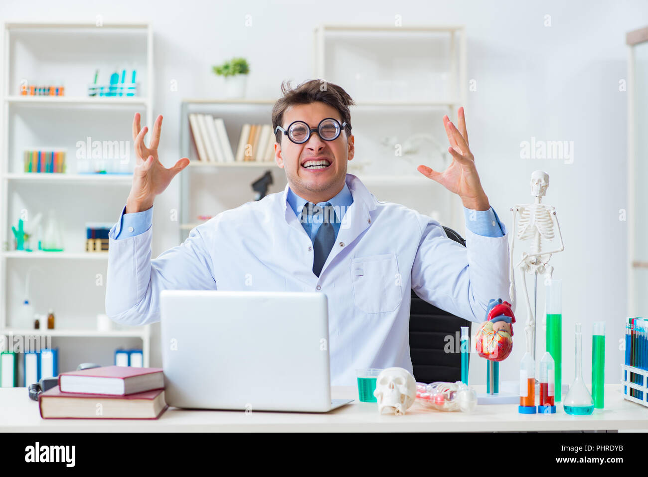 Funny doctor having fun in hospital lab Stock Photo - Alamy