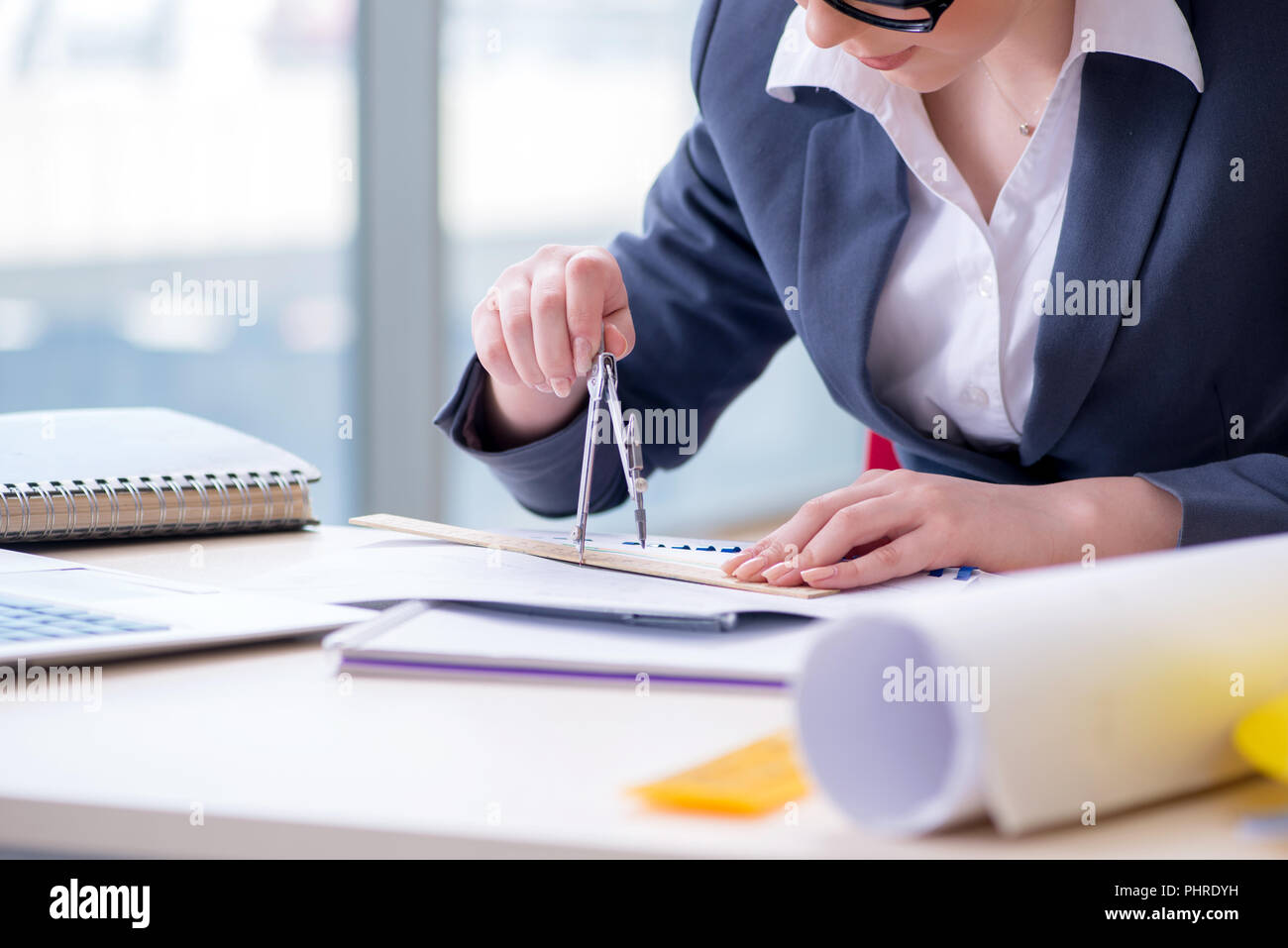 Woman architect working on the project Stock Photo - Alamy