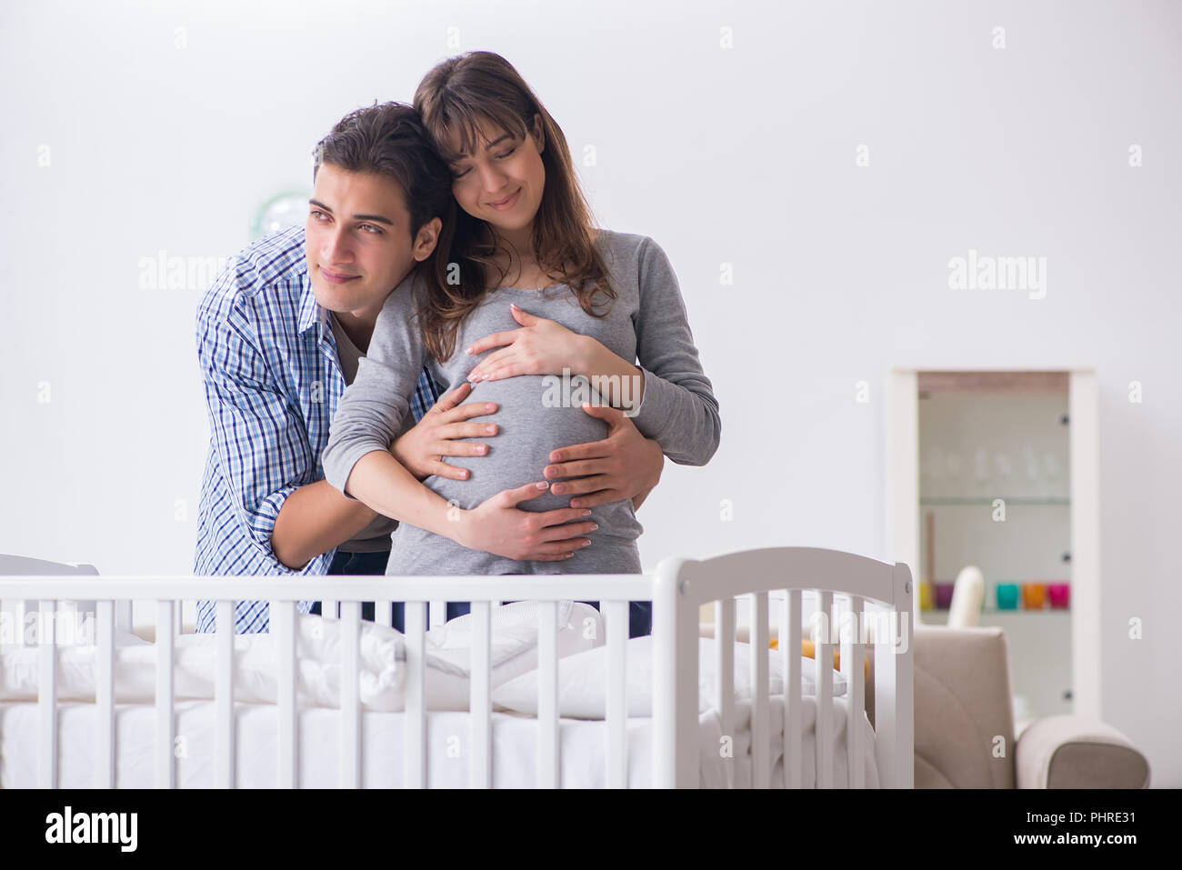 Young parents expecting their first baby Stock Photo - Alamy