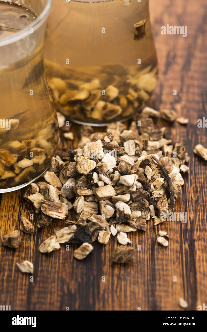 Teaglass with yellowhead root tea Stock Photo - Alamy