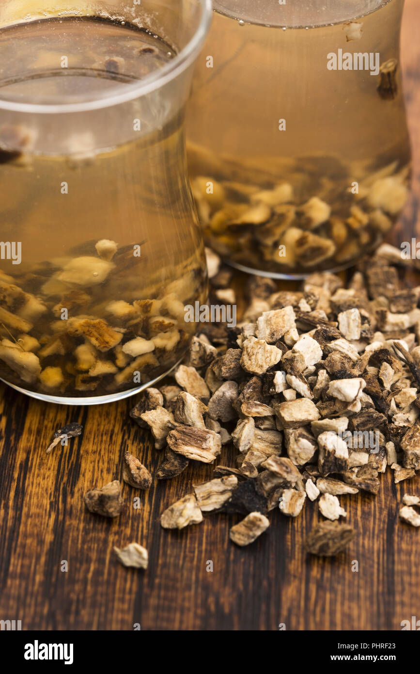 Teaglass with yellowhead root tea Stock Photo - Alamy