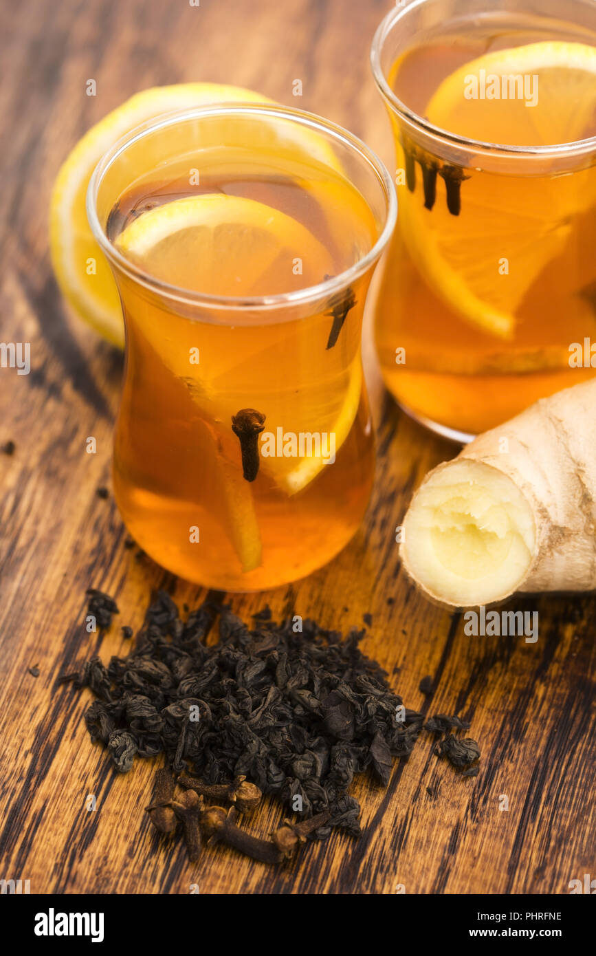 Black tea with lemon and ginger Stock Photo - Alamy