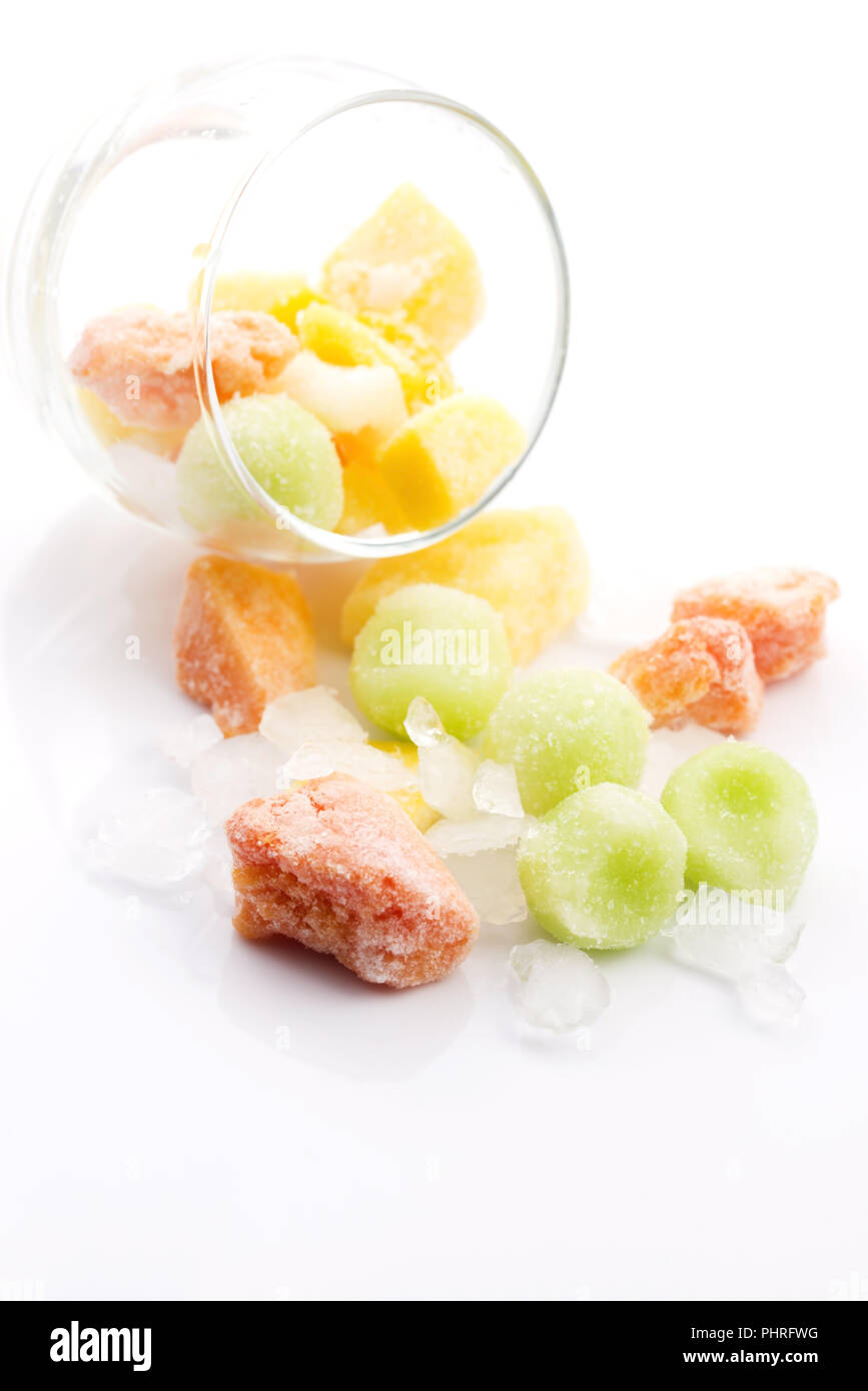 frozen exotic fruits on white background Stock Photo - Alamy
