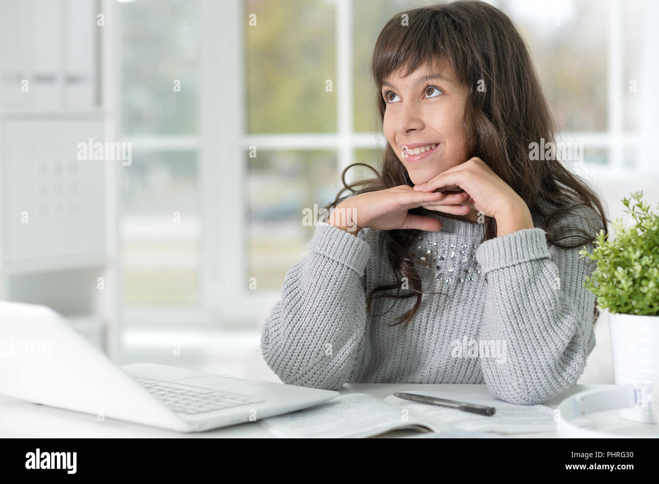 Portrait of a beautiful girl with laptop Stock Photo - Alamy