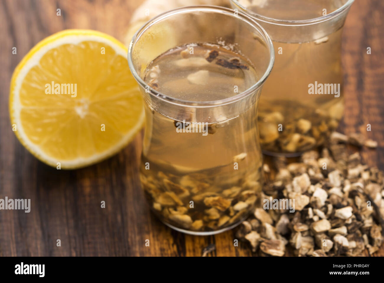 Teaglass with yellowhead root tea Stock Photo - Alamy