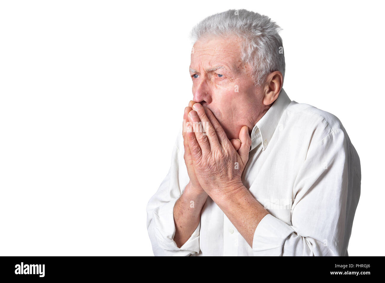 Portrait of a surprised senior man posing on white background Stock ...