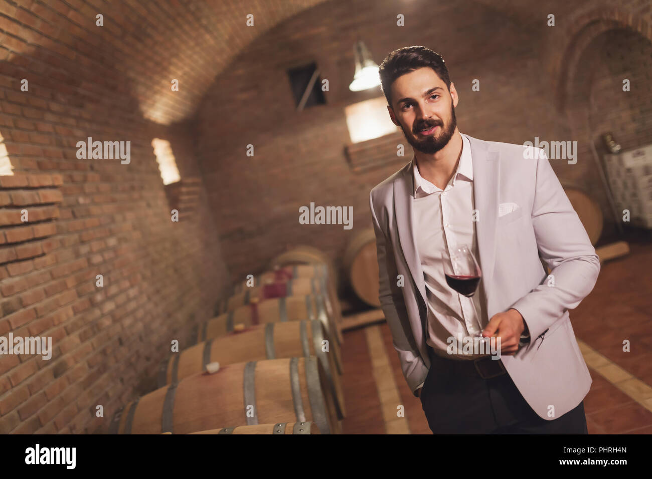 Oenologist tasting wines in cellar Stock Photo - Alamy