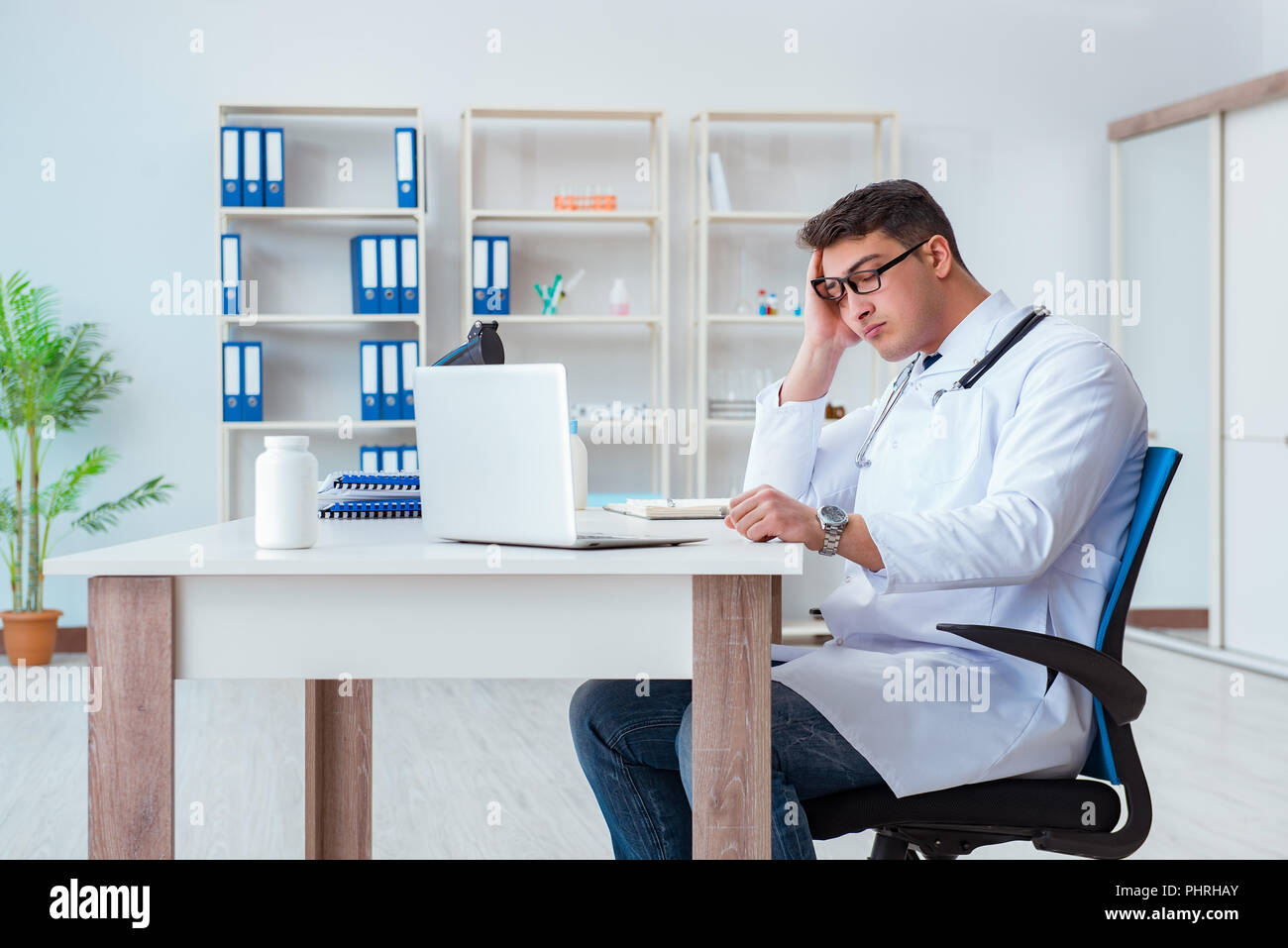Tired doctor after night shift Stock Photo - Alamy
