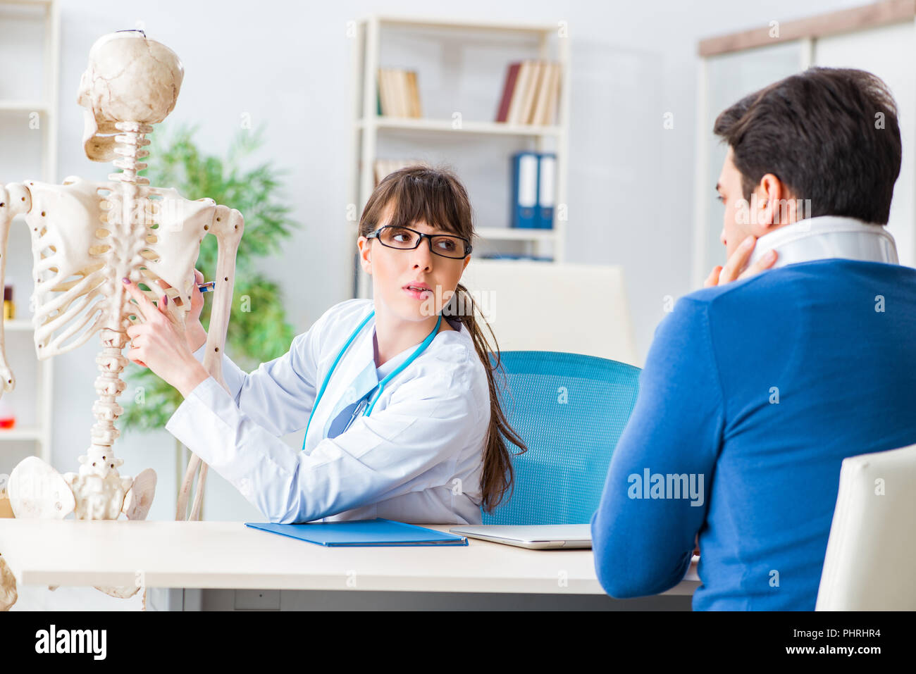 Doctor is explaining to patient with neck injury Stock Photo - Alamy