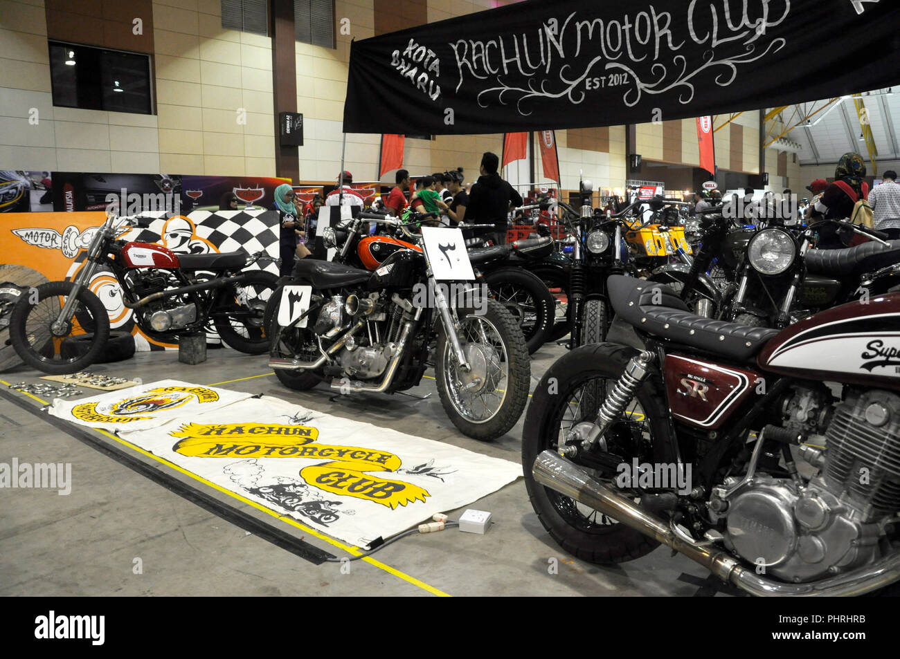 Big bike and custom motorcycle in huge showroom. Displayed to crowd for ...