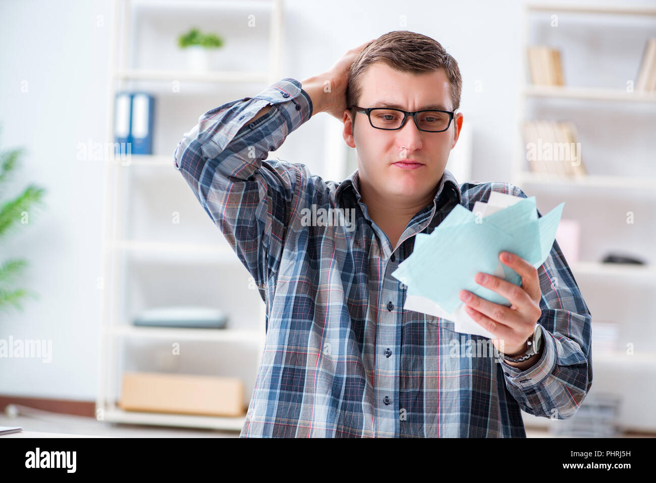 Confused man bills hi-res stock photography and images - Alamy