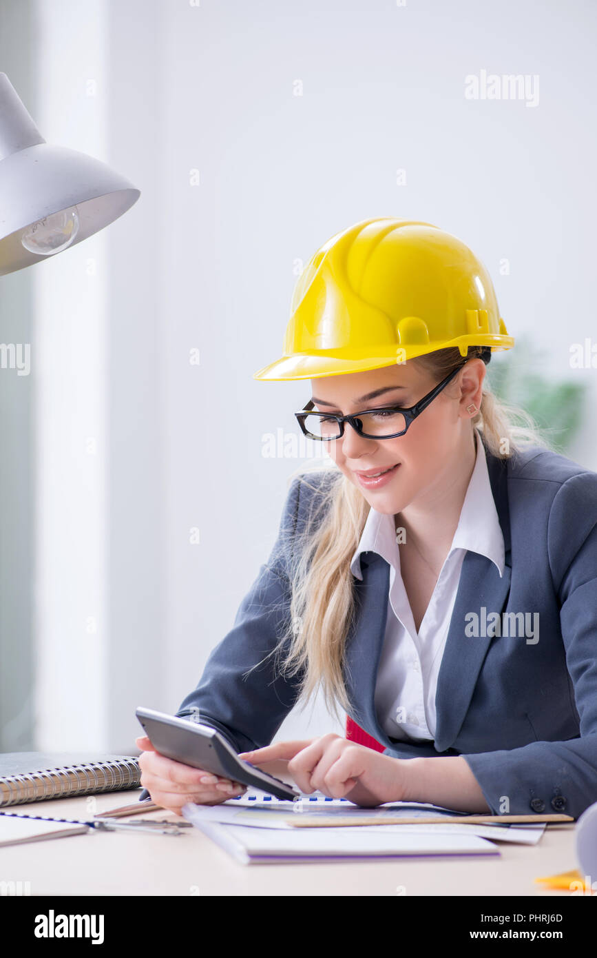Woman architect working on the project Stock Photo - Alamy