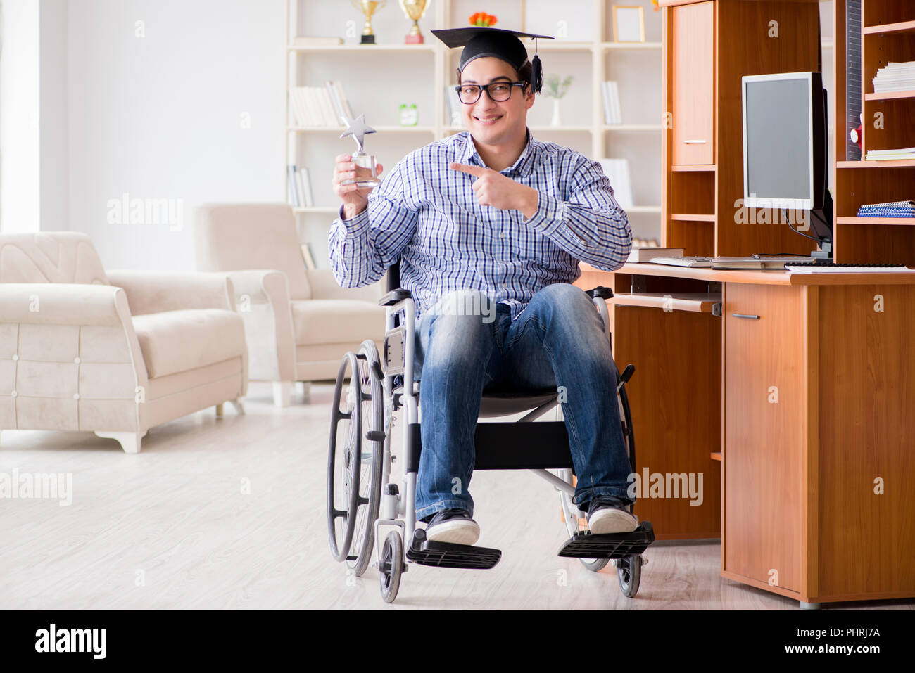 Disabled student studying at home on wheelchair Stock Photo - Alamy