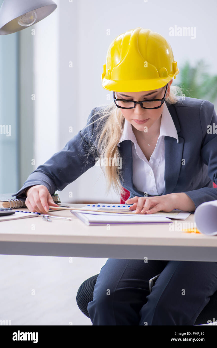 Woman architect working on the project Stock Photo - Alamy