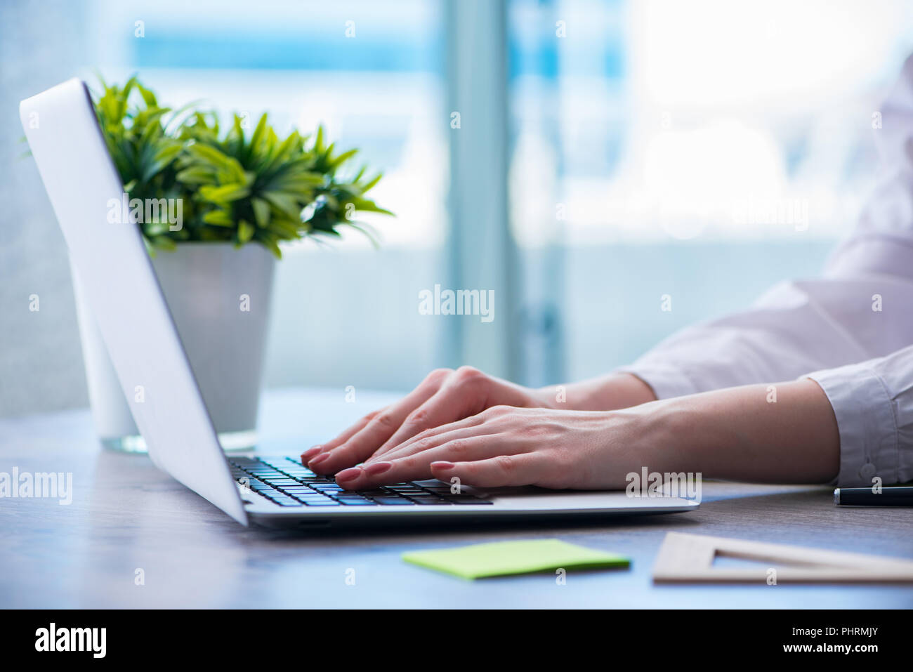 Woman hands working on computer at desk Stock Photo - Alamy